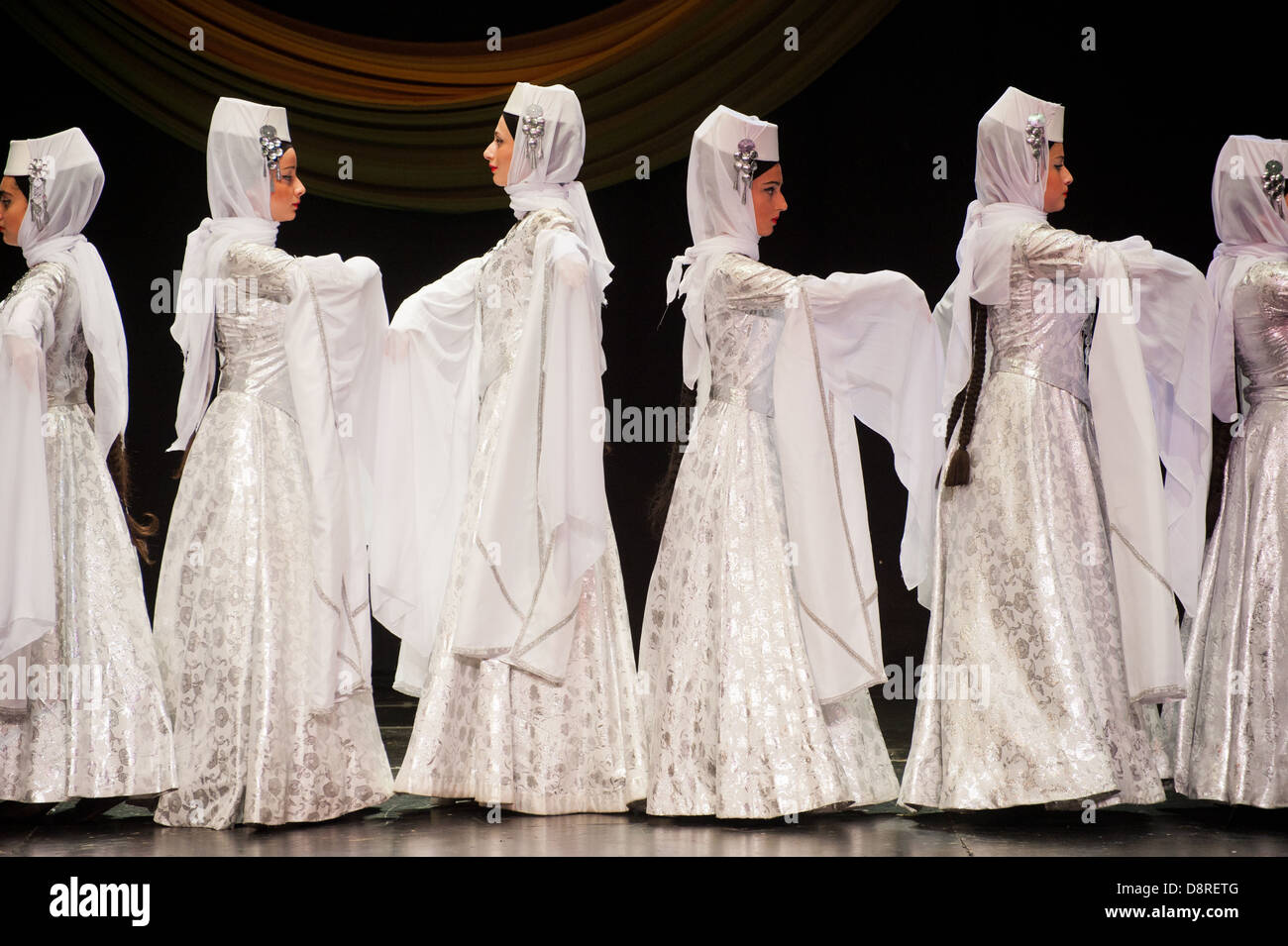 Georgian children dressed with traditional costumes dancing a folklore ...
