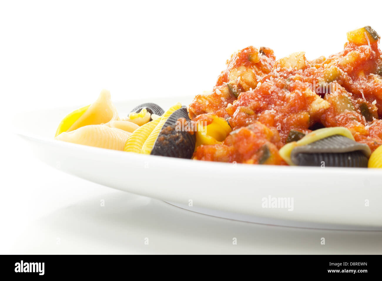 Shell noodles with tomato sauce on a plate Stock Photo - Alamy