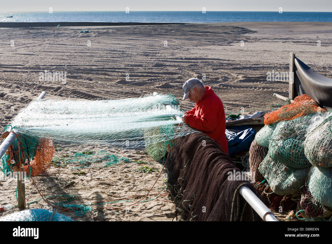 Fisherman fixing net, Aguda beach Vila Nova de Gaia Portugal Stock ...