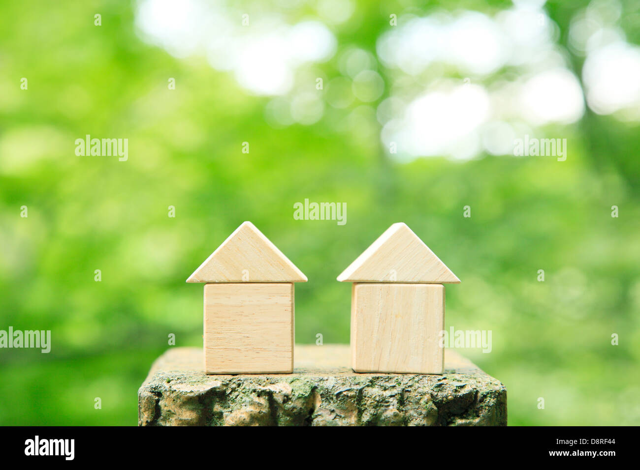 Wooden houses made of building blocks Stock Photo - Alamy