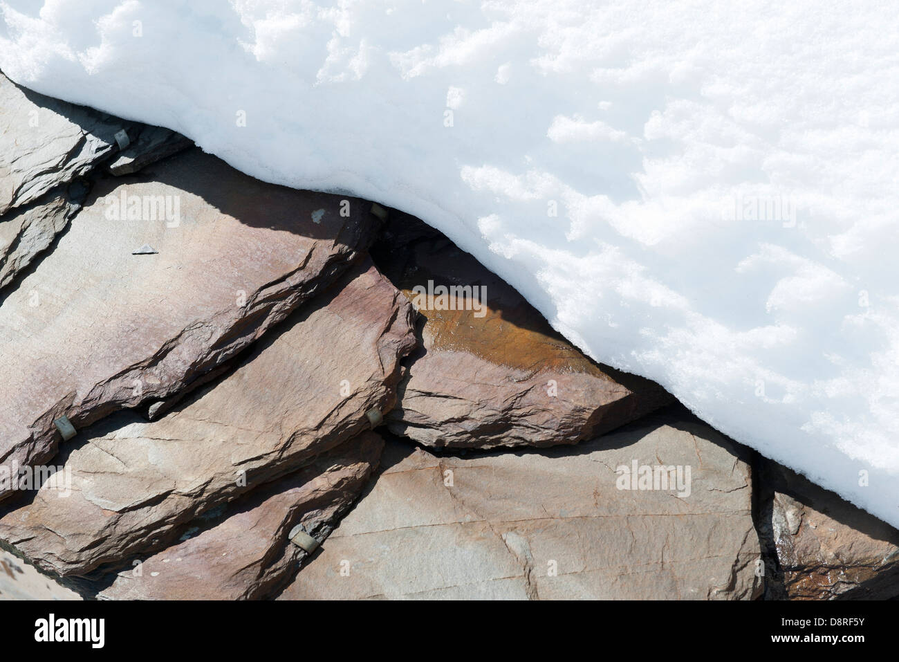 Snow on stones Stock Photo - Alamy