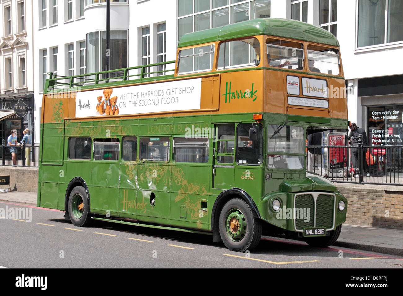 A London routemaster tour bus painted in the livery of the Harrods ...