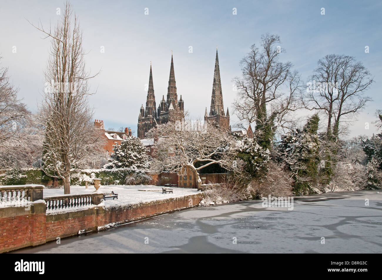 Lichfield Cathedral and the Memorial Gardens with frozen Minster Pool ...