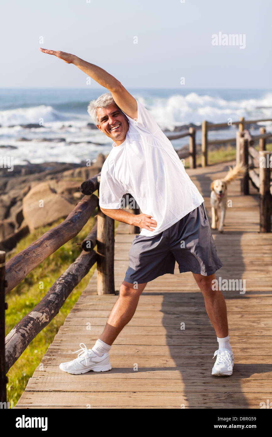 happy senior man doing morning exercise at the beach Stock Photo - Alamy
