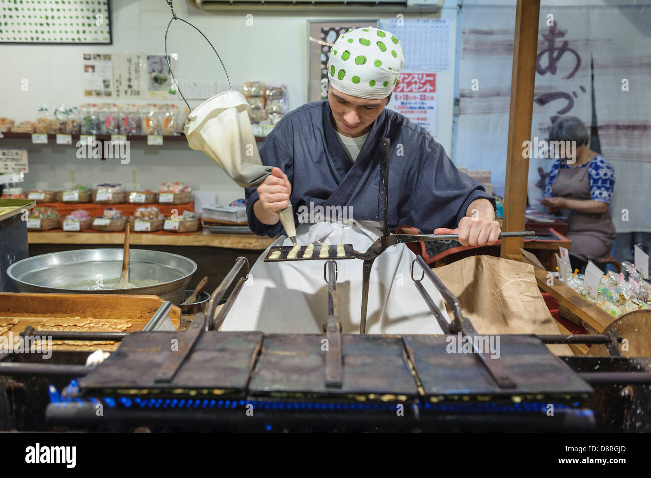 Man making cookies in a food stall, Kyoto, Japan, Asia Stock Photo - Alamy