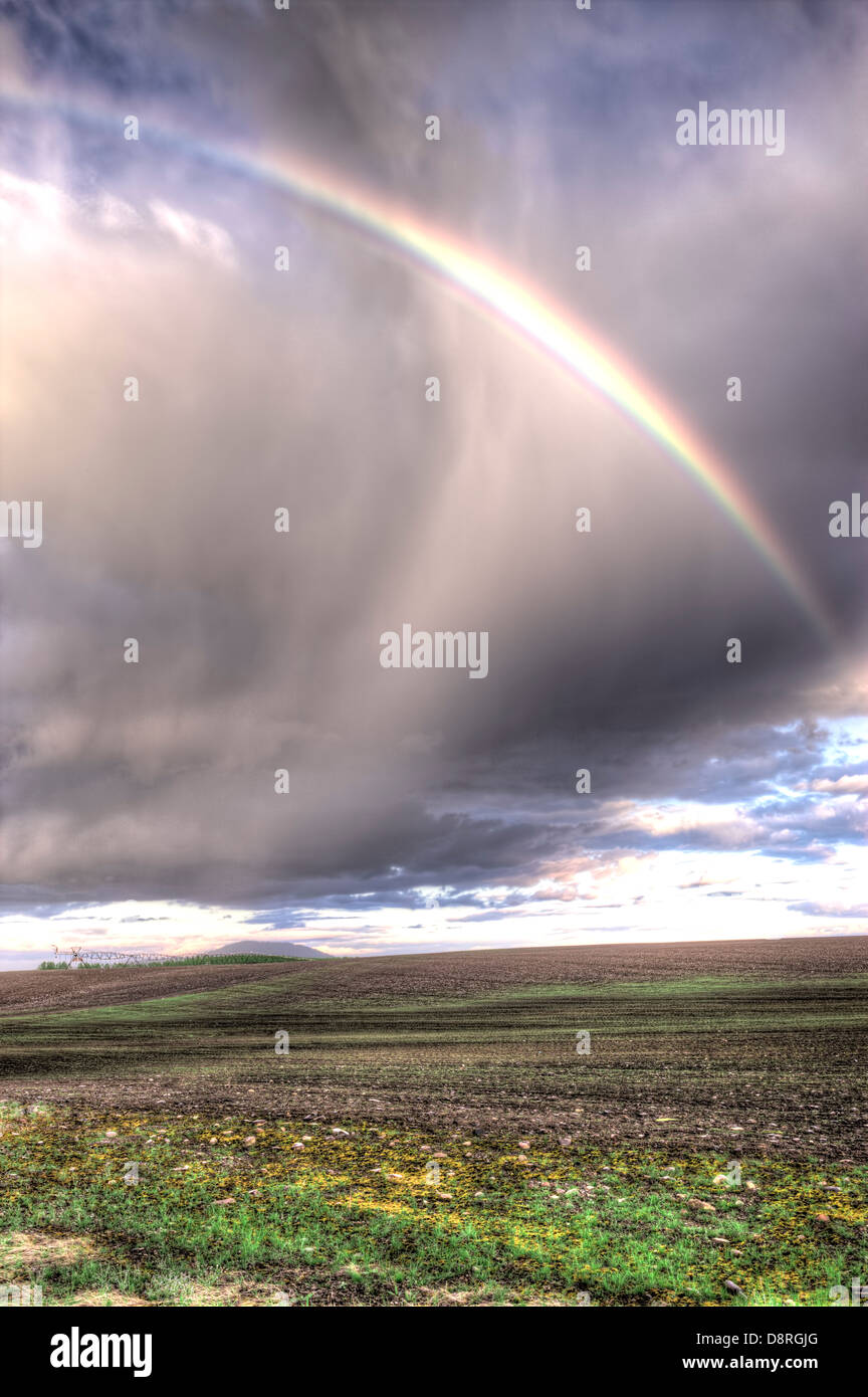 Rainbow over the prairie Stock Photo - Alamy