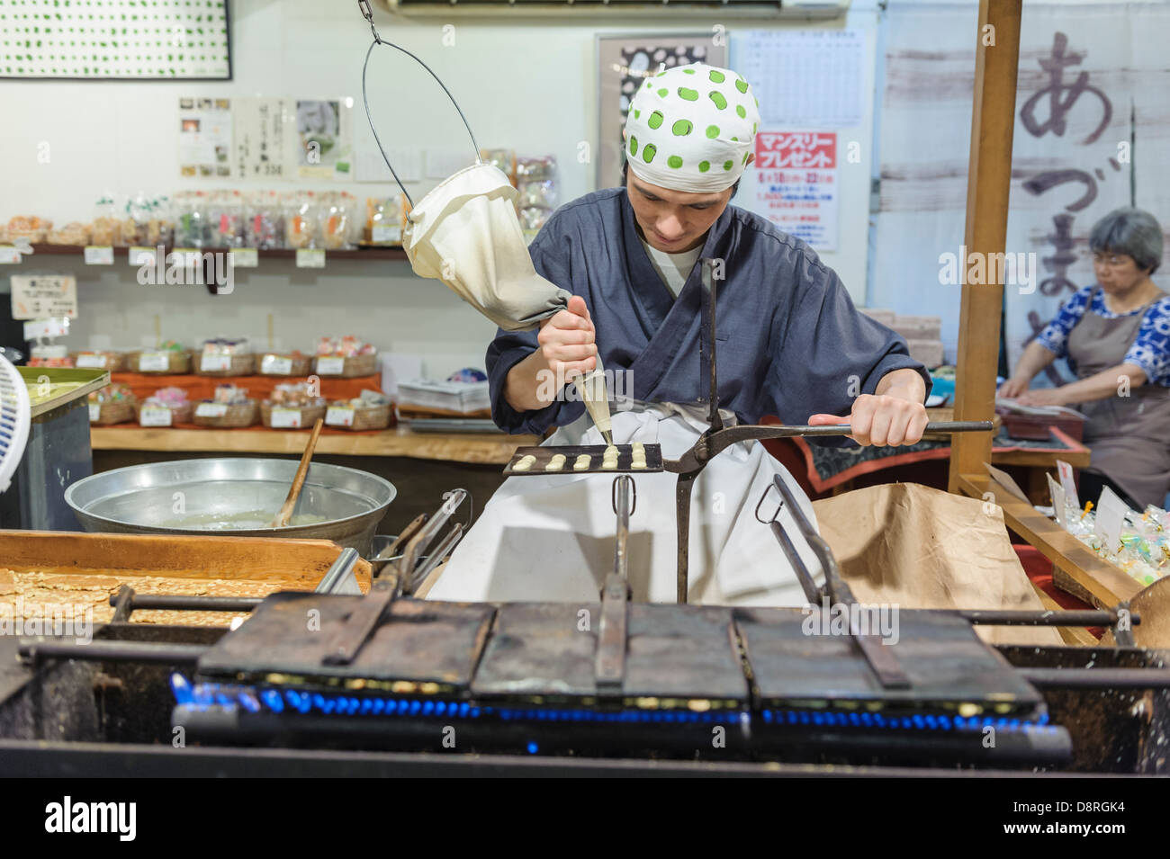 Man making cookies in a food stall, Kyoto, Japan, Asia Stock Photo - Alamy