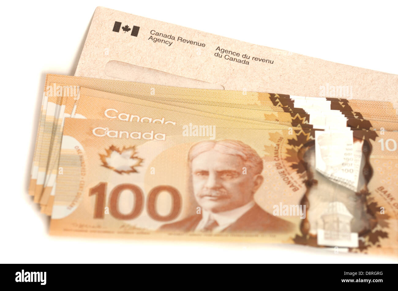 A series of 100 hundred Canadian dollars in brown envelop Stock Photo ...