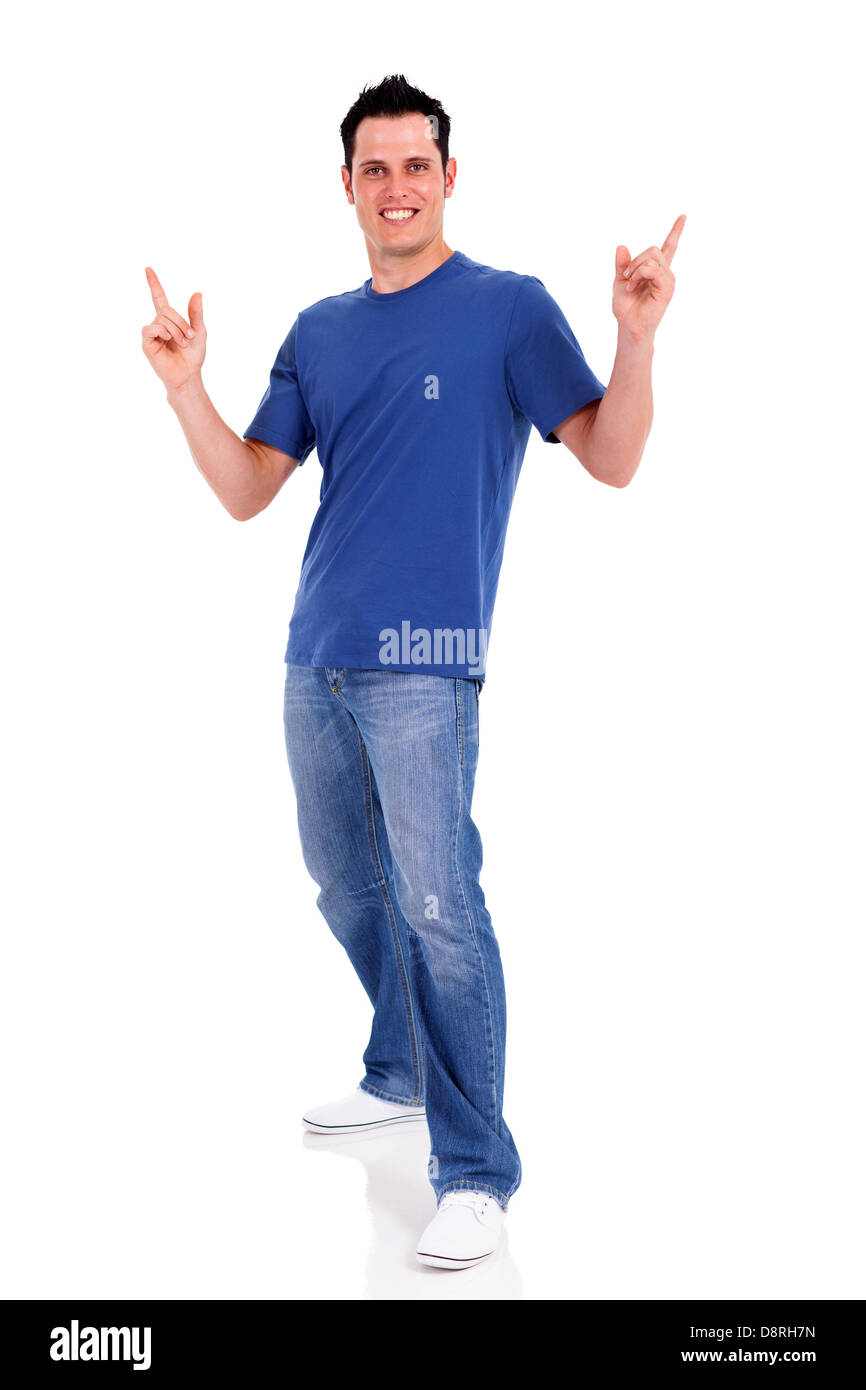 casual young man pointing on white background Stock Photo - Alamy