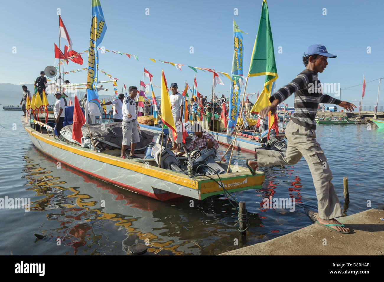 Man jumping off the boat during Jailolo festival celebrations, Maluku ...