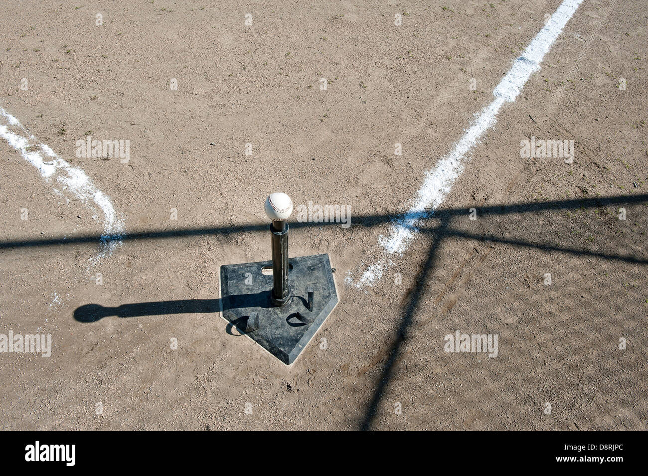 T-ball stand and ball on home plate Stock Photo - Alamy
