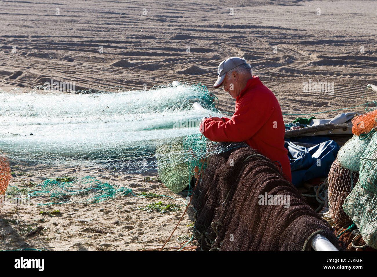 Fisherman fixing net, Aguda beach Vila Nova de Gaia Portugal Stock ...