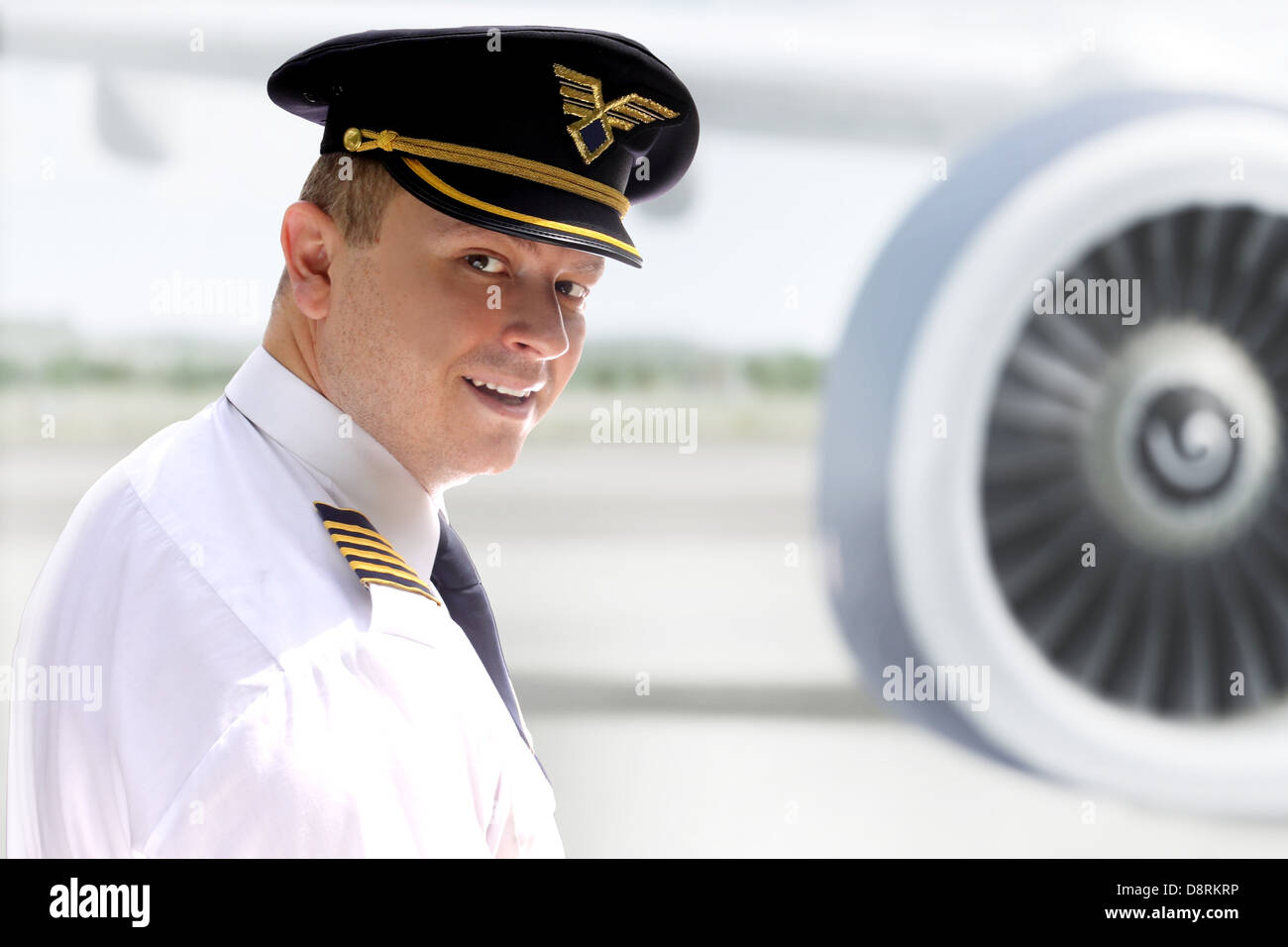 Cheerful pilot against the huge engine aircraft Stock Photo - Alamy