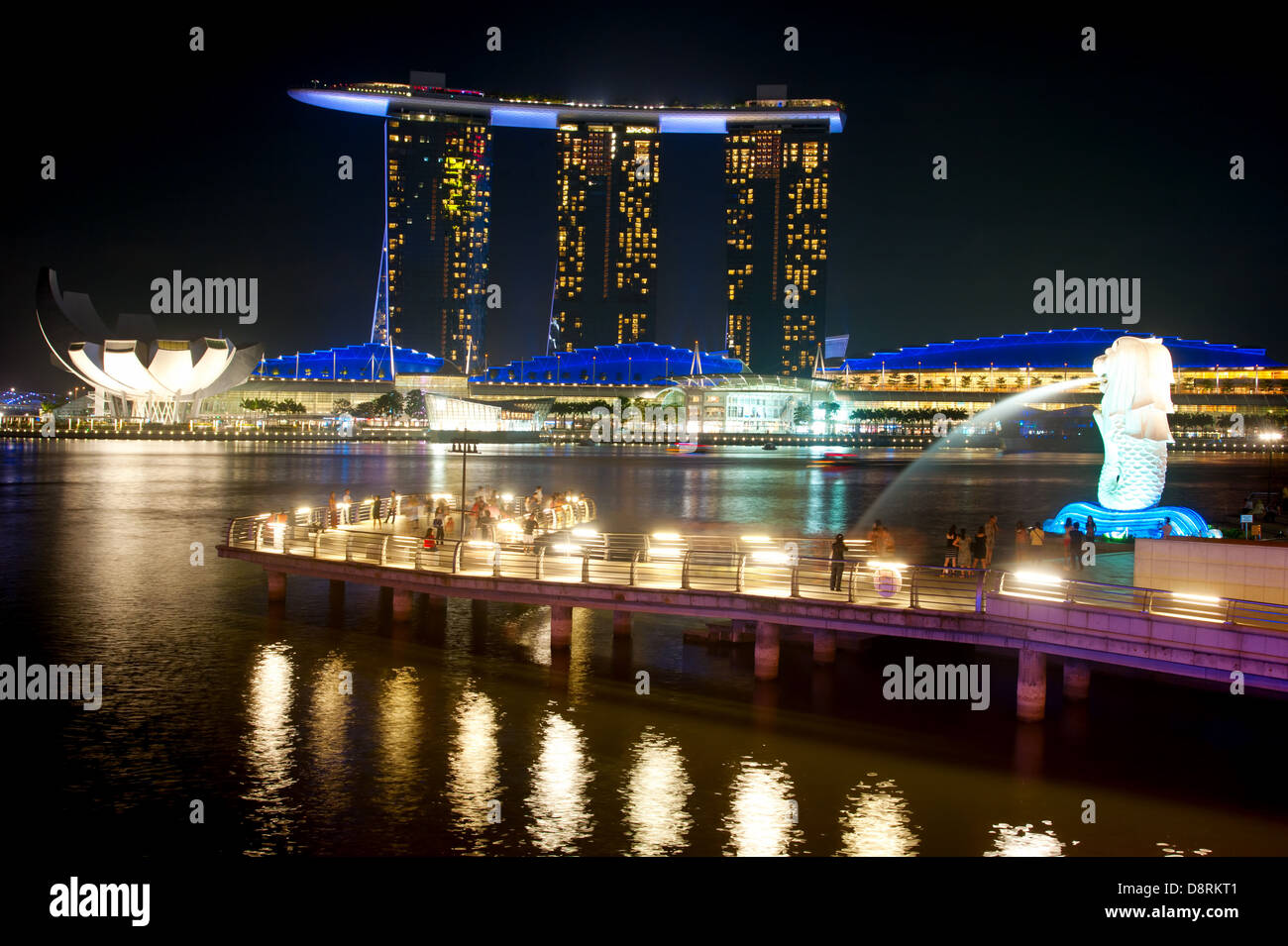 The Merlion fountain spouts water in front of the Marina Bay Sands ...