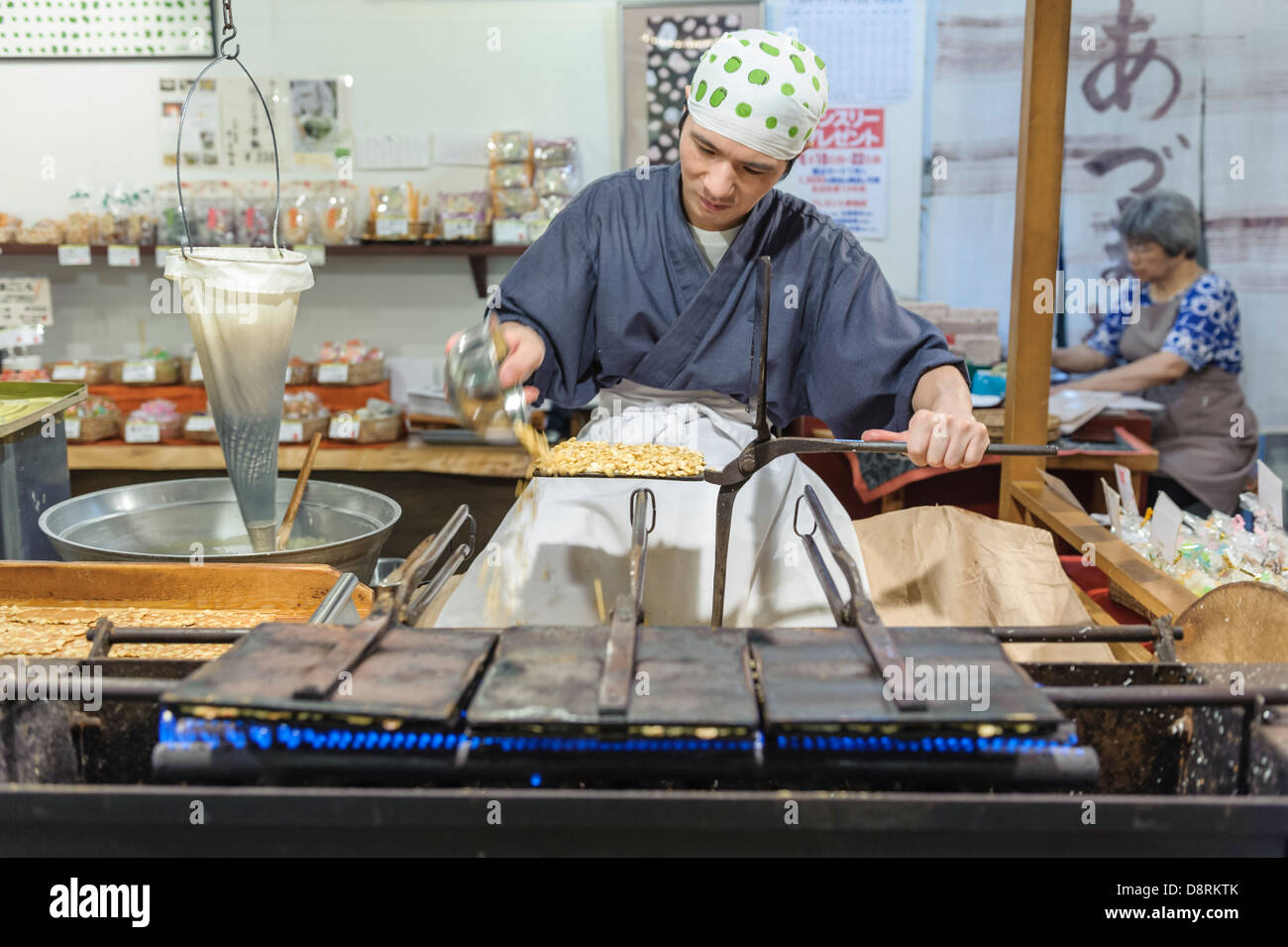 Man making cookies in a food stall, Kyoto, Japan, Asia Stock Photo - Alamy