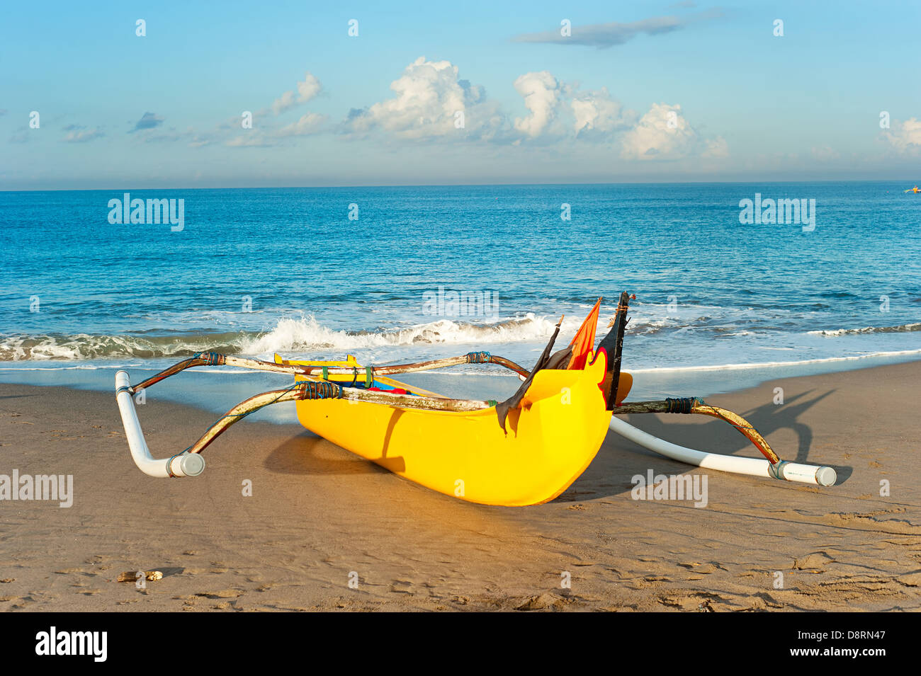 Traditional indonesian fishing boat on Bali ocean beach Stock Photo - Alamy