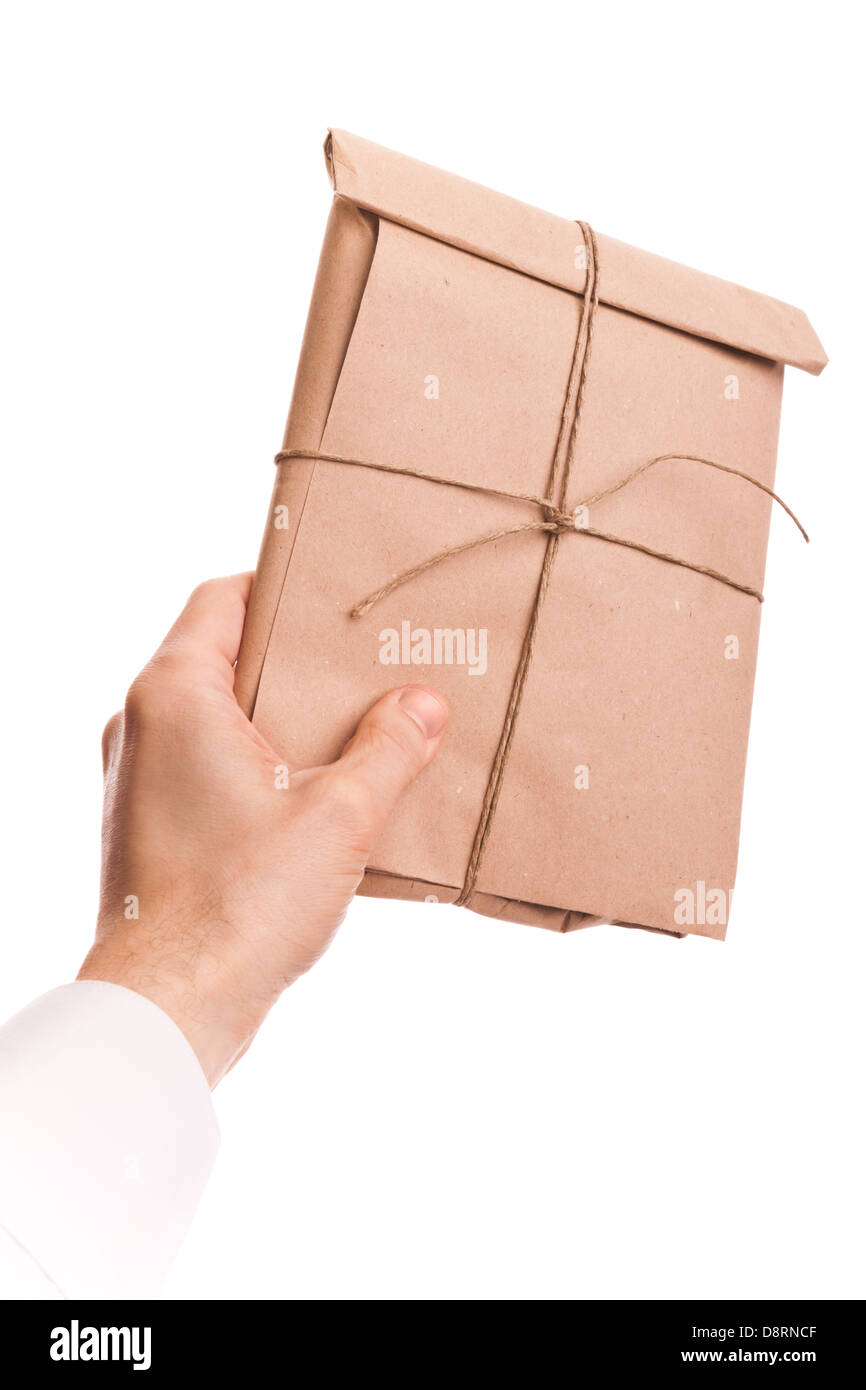 Male hand holds envelope tied with a rope isolated on white background ...