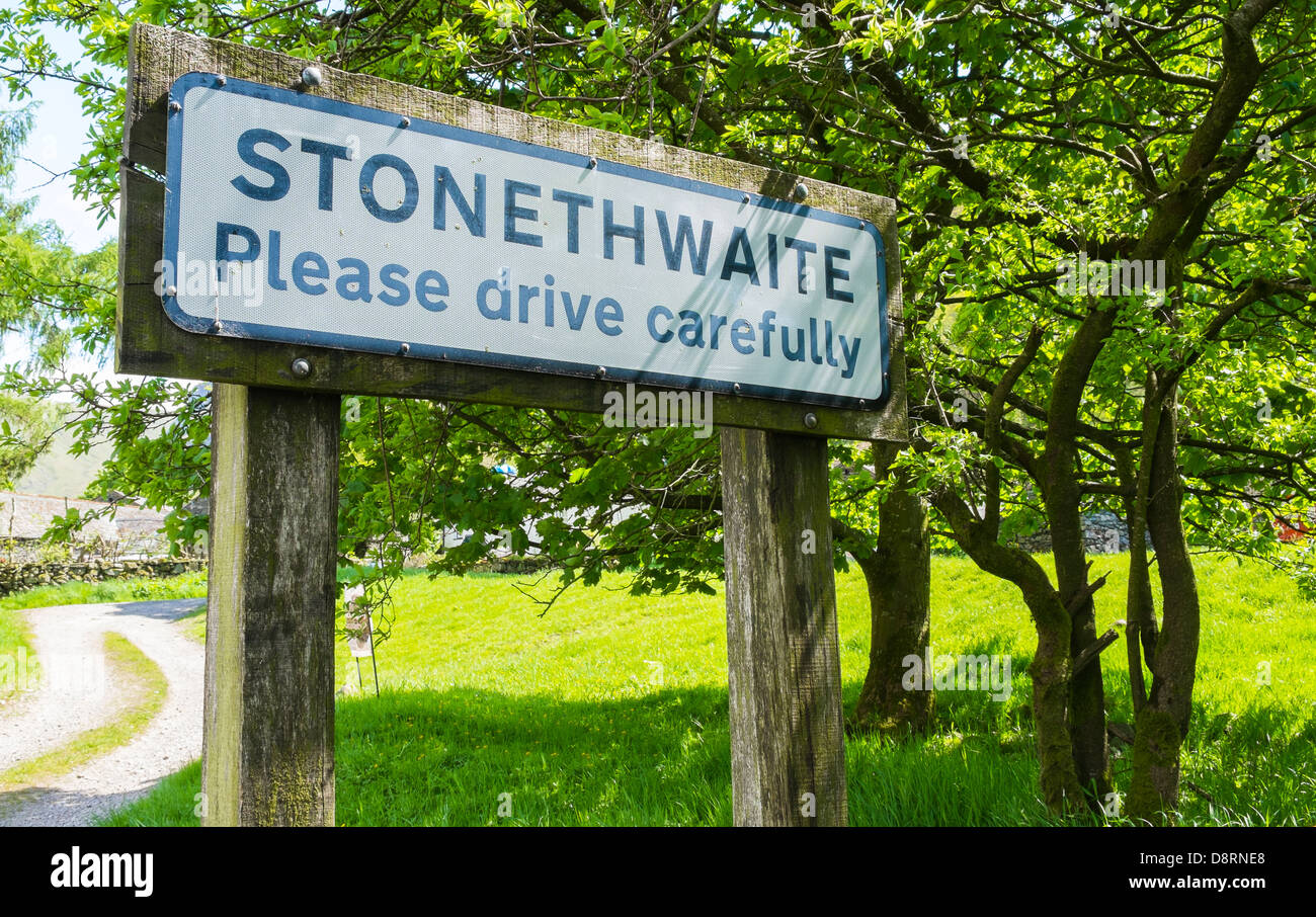 Stonethwaite, Please drive carefully sign Stock Photo - Alamy
