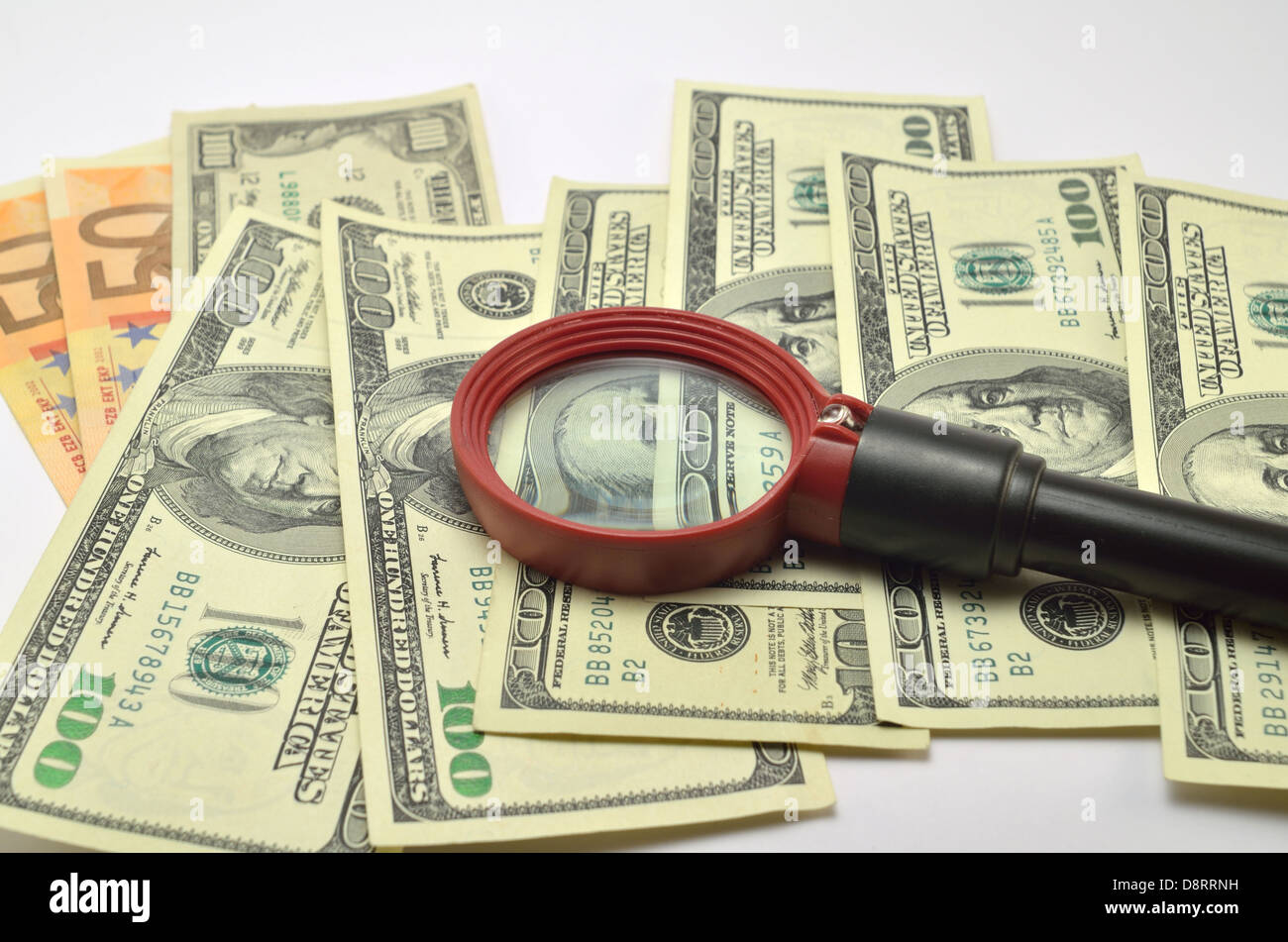 loupe and a lot of notes on a white background Stock Photo - Alamy