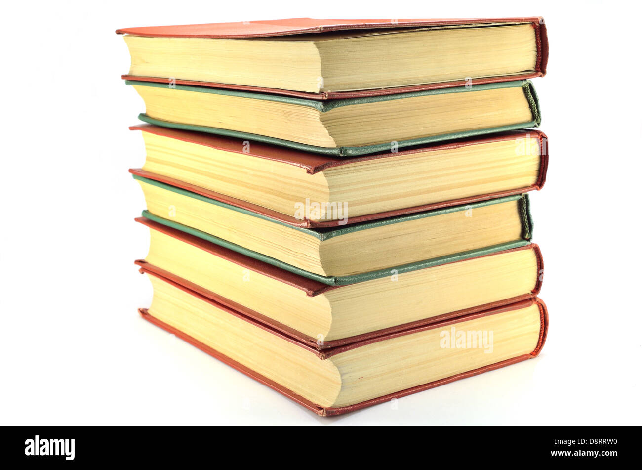 a stack of books in a small amount over a white background Stock Photo ...