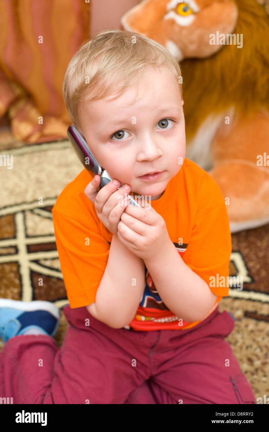 little kid speaks over cell phone Stock Photo - Alamy