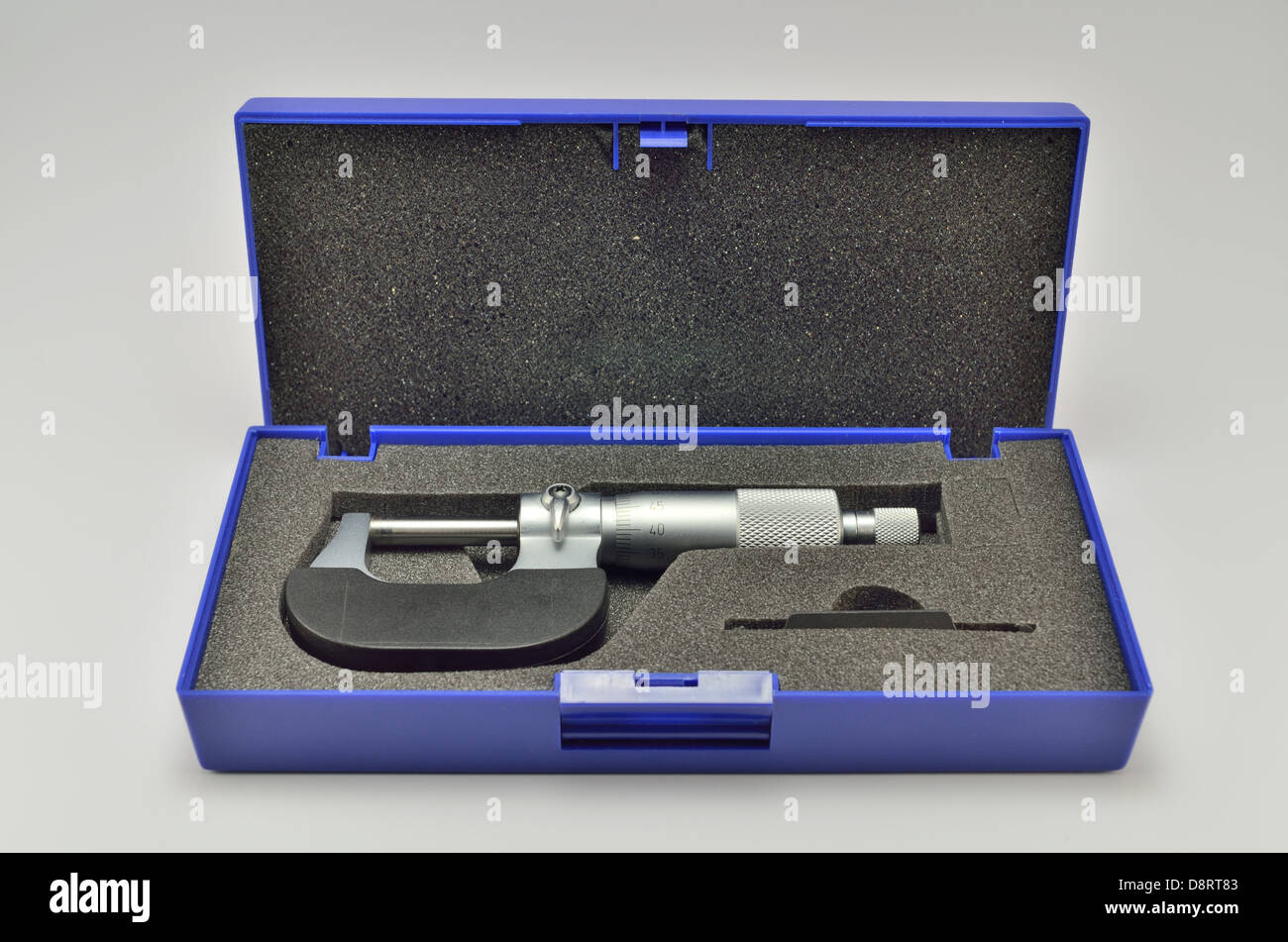micrometer in a blue box on a white background Stock Photo - Alamy