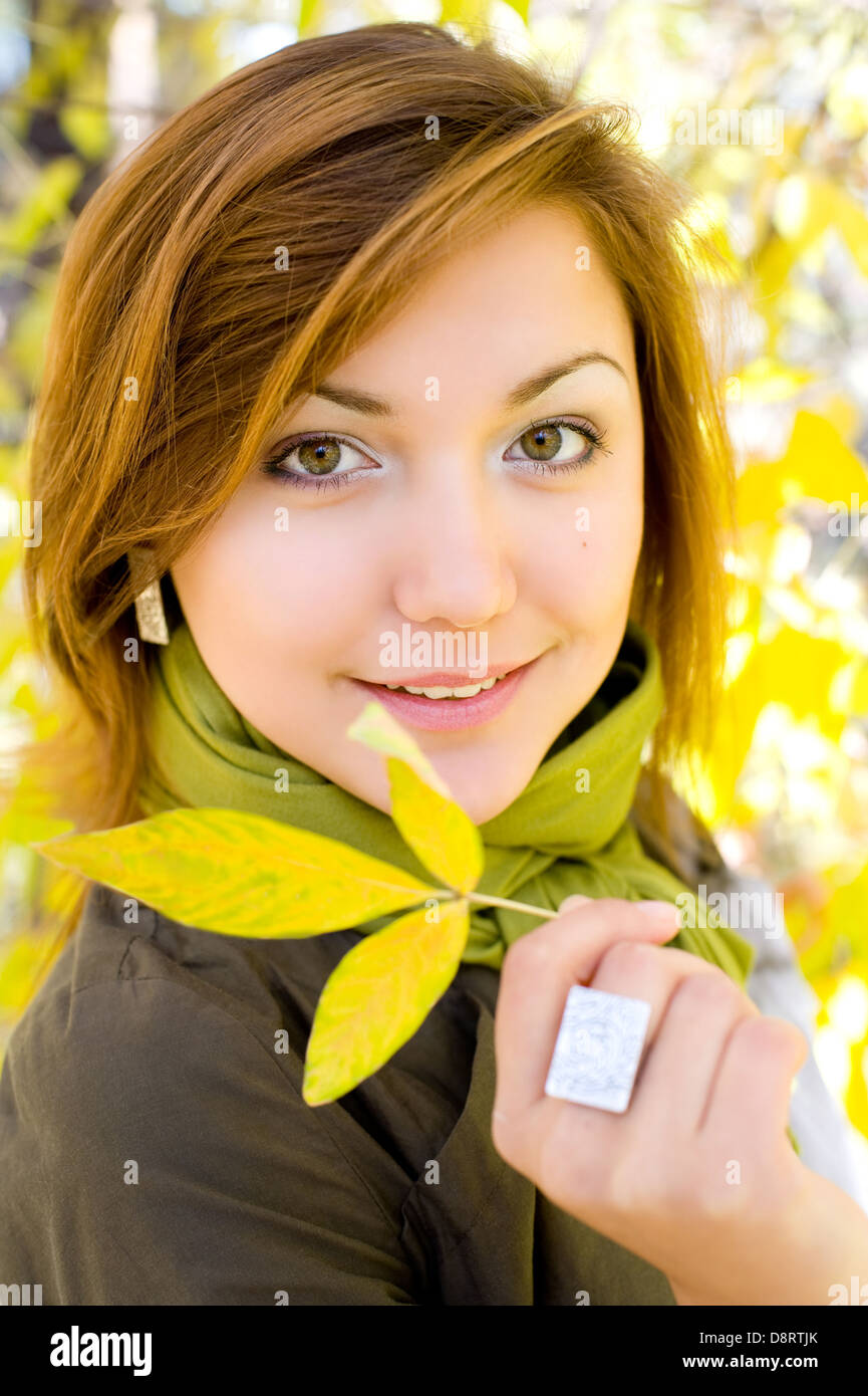 beautiful girl with autumn leaf Stock Photo - Alamy