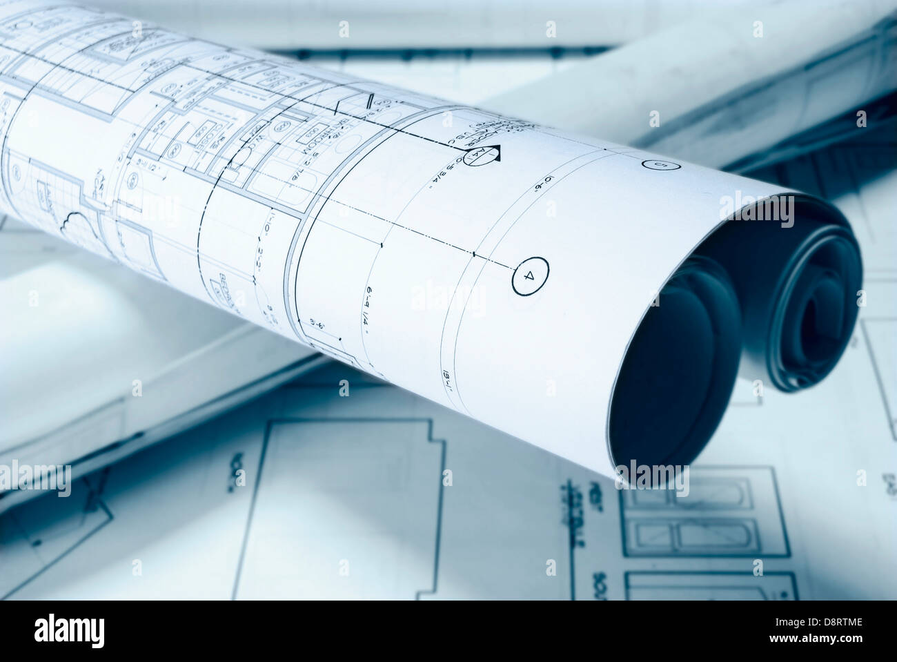 Rolled architectural blueprints construction plans hi-res stock ...