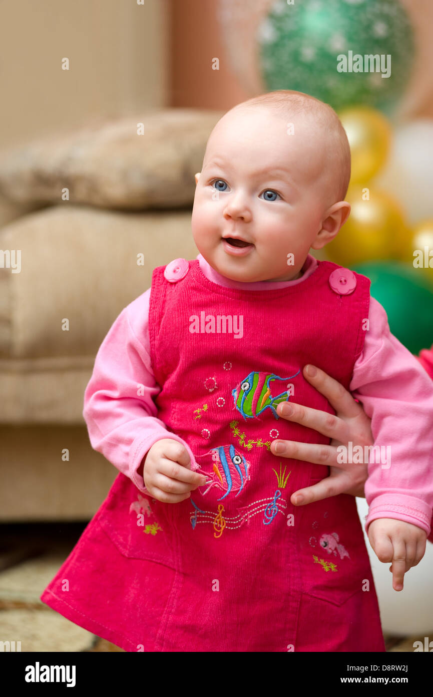 baby girl in red dress Stock Photo - Alamy