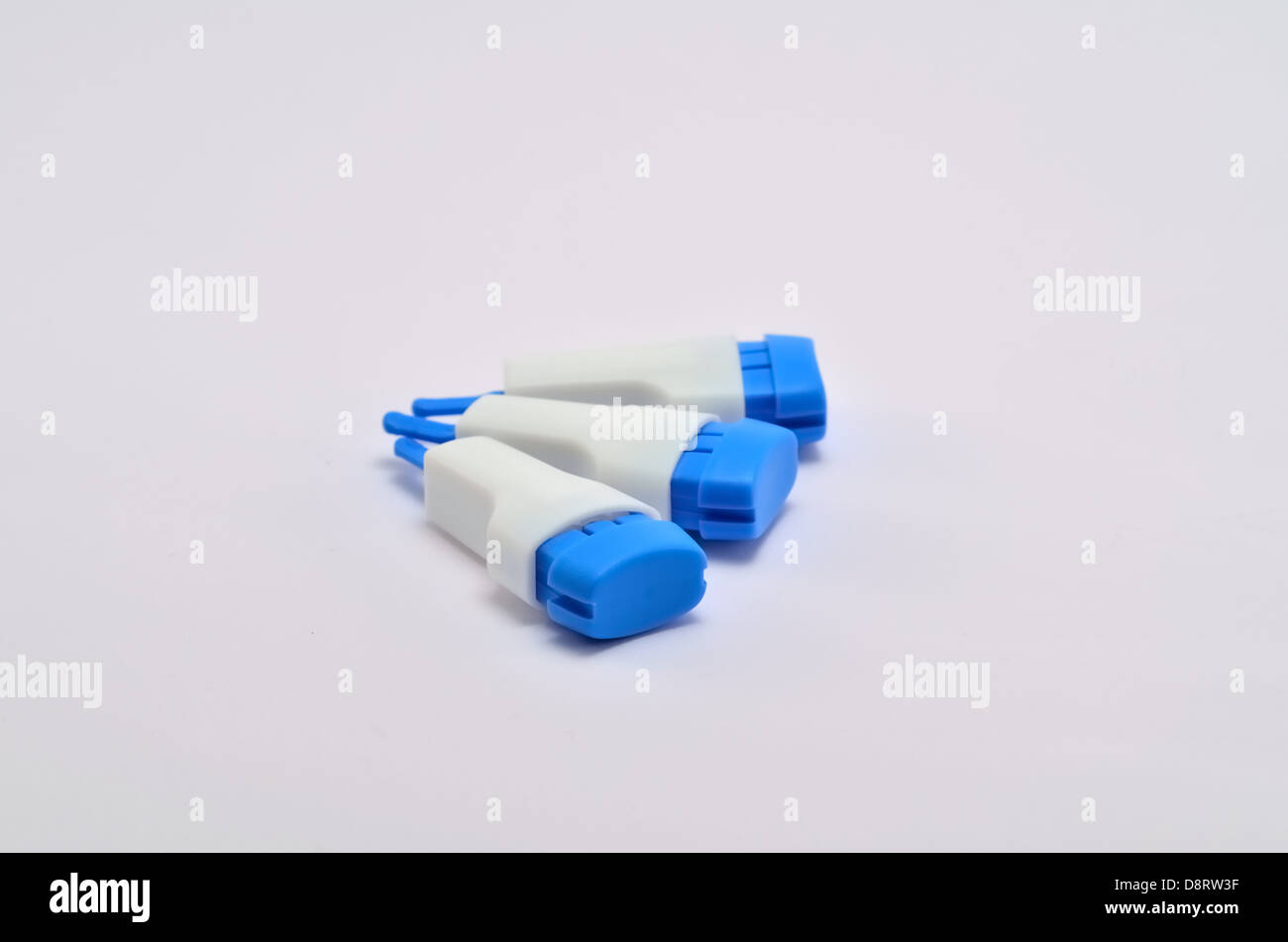 devices to puncture the finger on a white background Stock Photo - Alamy