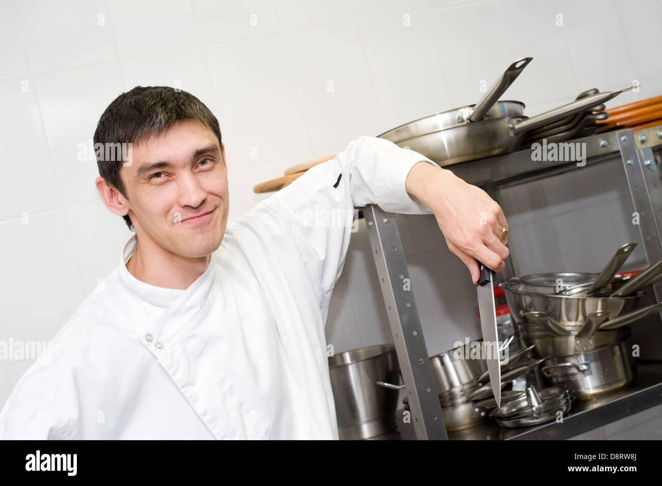 chef with knife in kitchen Stock Photo - Alamy