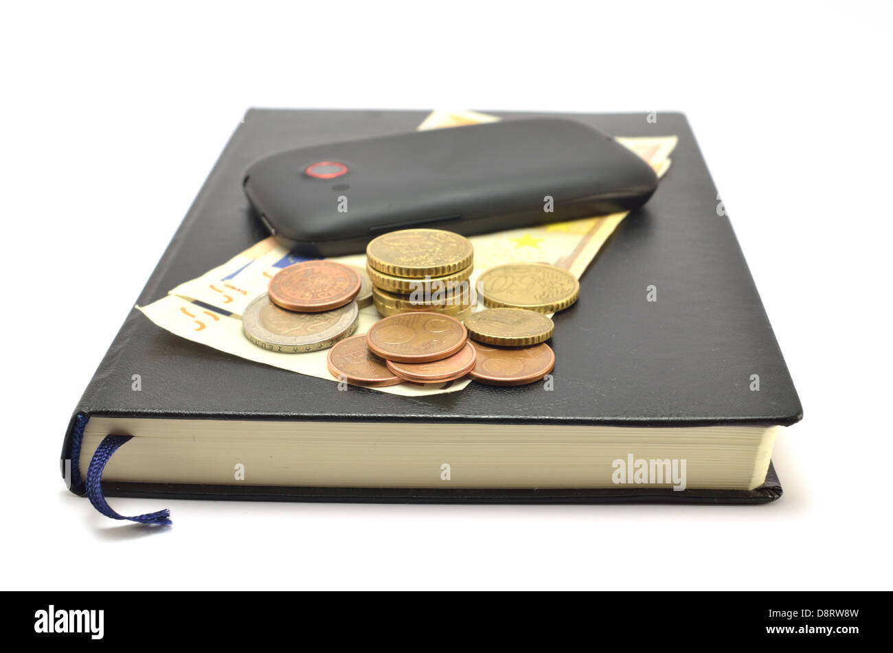 notebook, mobile phone, coins and banknotes on a white background Stock ...
