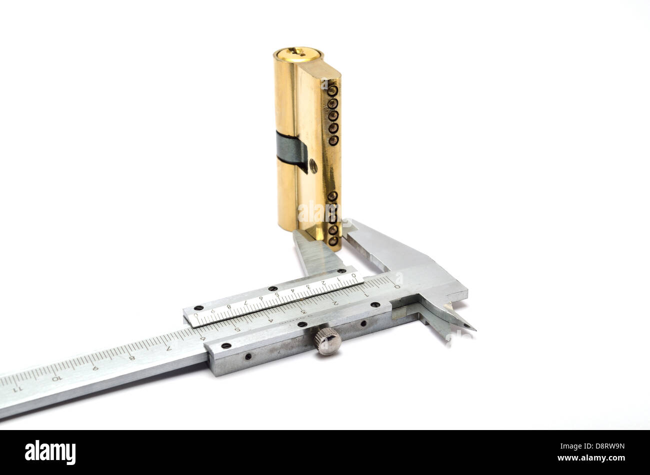lock and the measuring instrument are on a white background Stock Photo ...