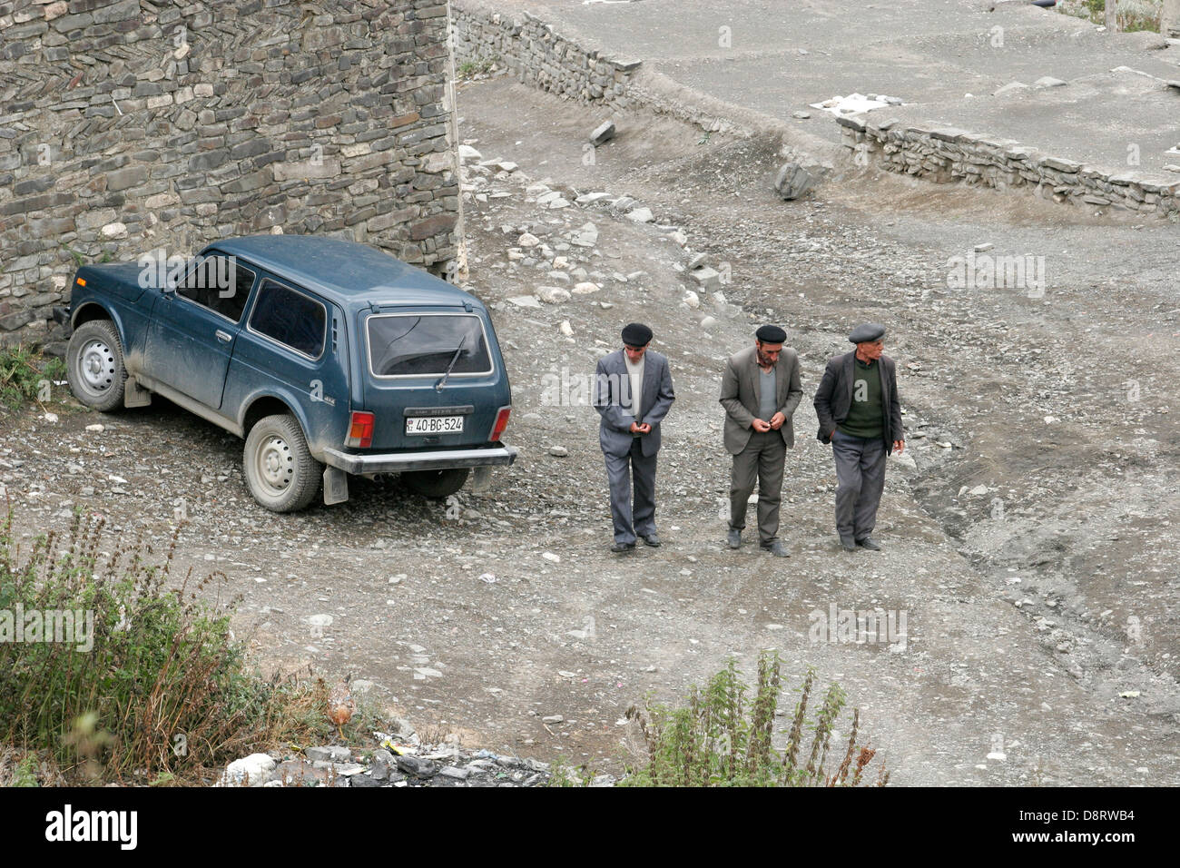 Azeri men walking on the street of the shepherd mountain village of ...