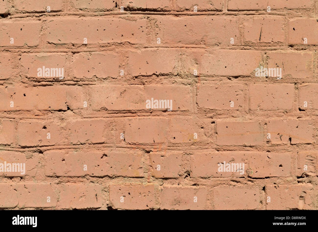 red brick wall painted with red paint Stock Photo - Alamy