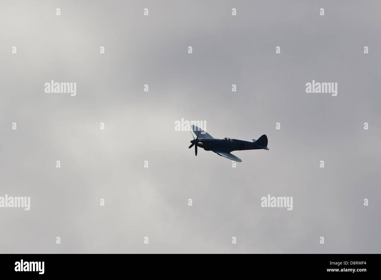 Supermarine Spitfire single seater fighter aircraft flying in cloudy ...