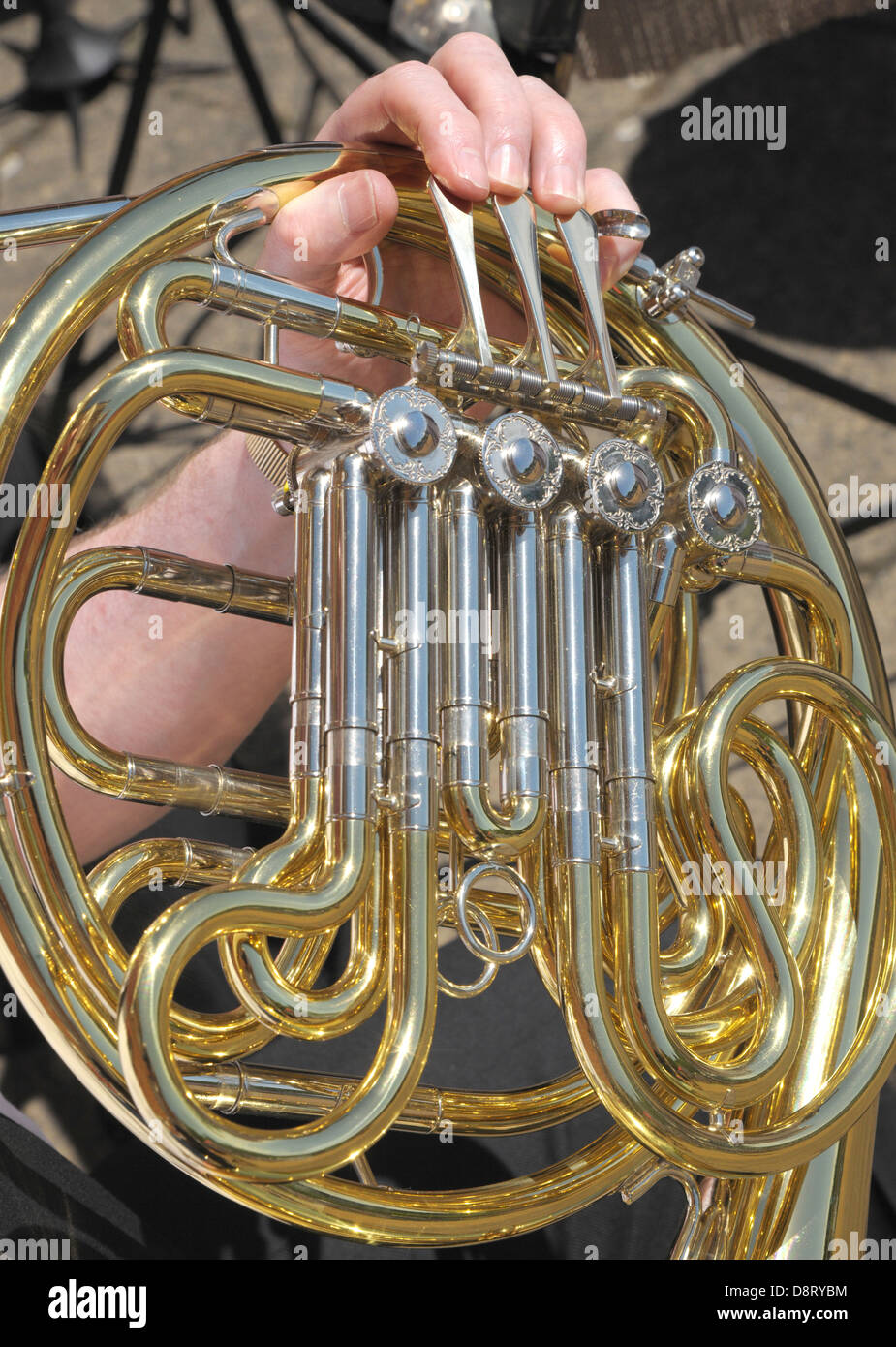 Detail of a musicians fingers playing a French horn Stock Photo - Alamy