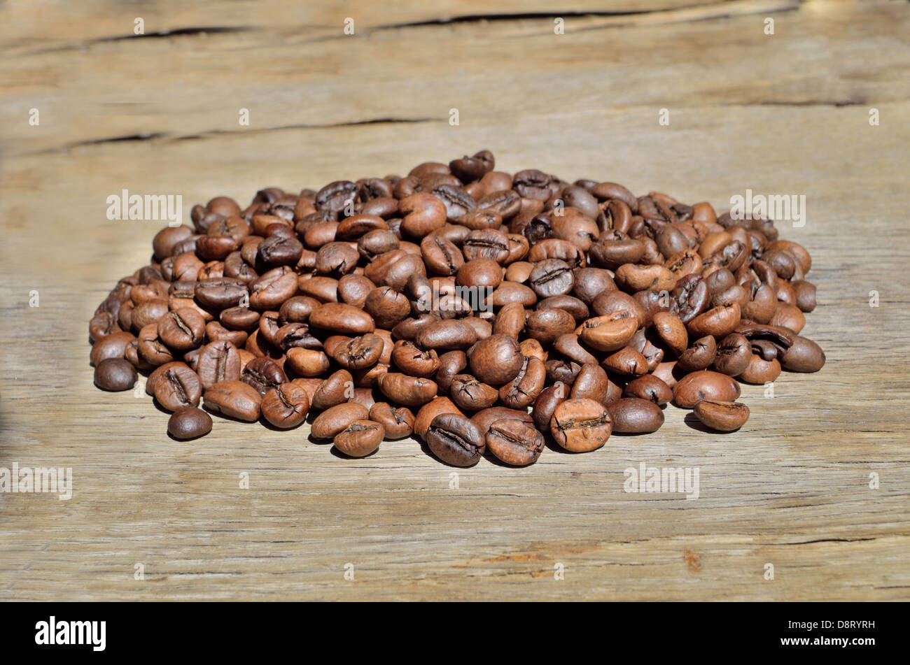 coffee beans rash on board Stock Photo - Alamy