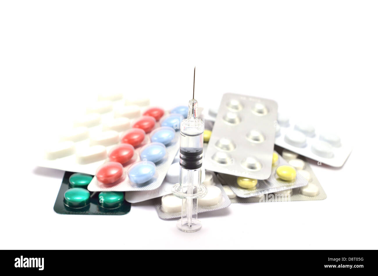 the plate of various of tablets and syringe a white background Stock ...