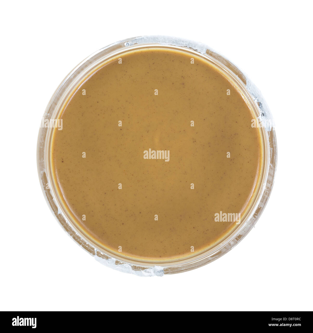 Top view of an opened but unused jar of peanut butter on a white ...