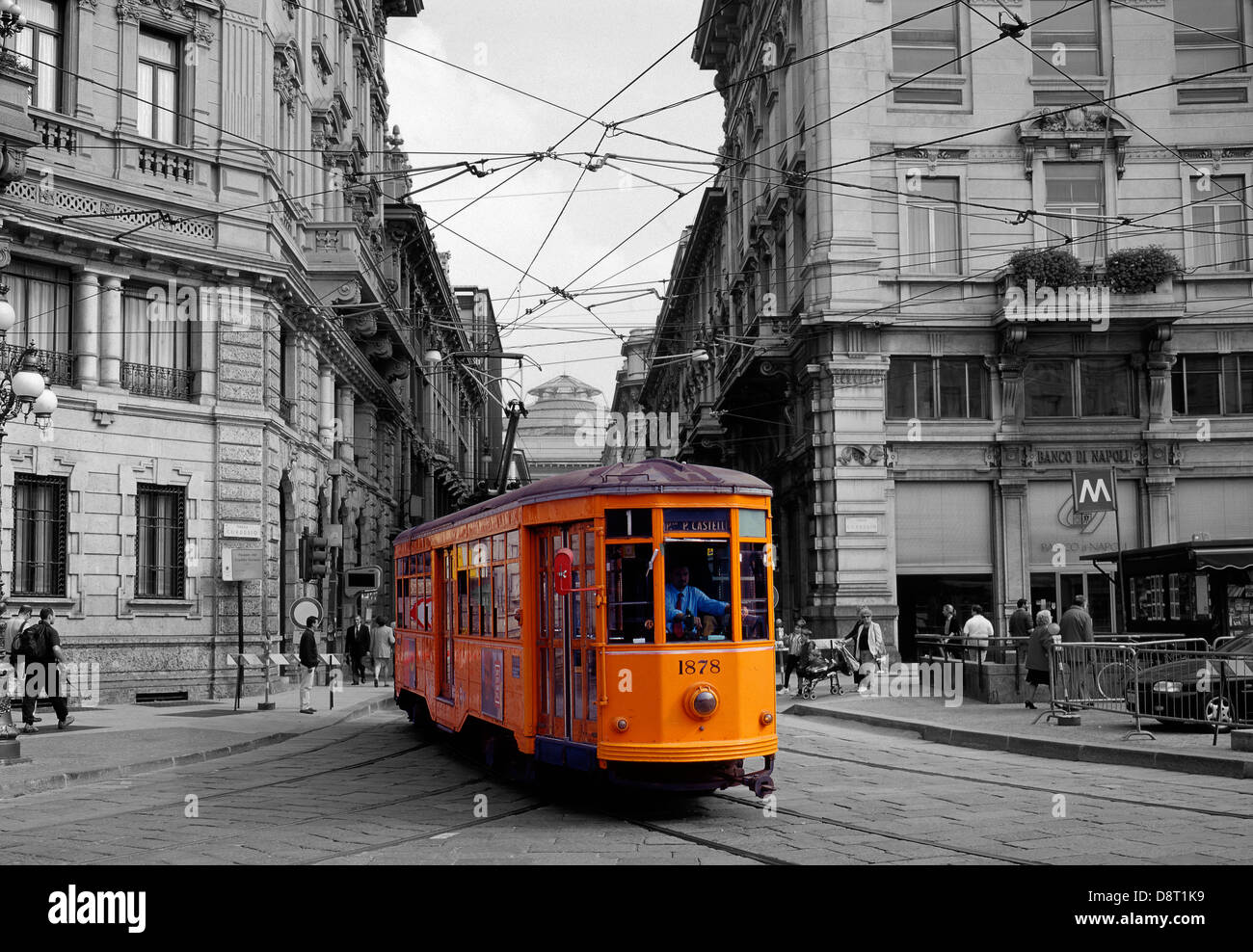 A traditional passenger tram with its web of overhead cables, in the ...