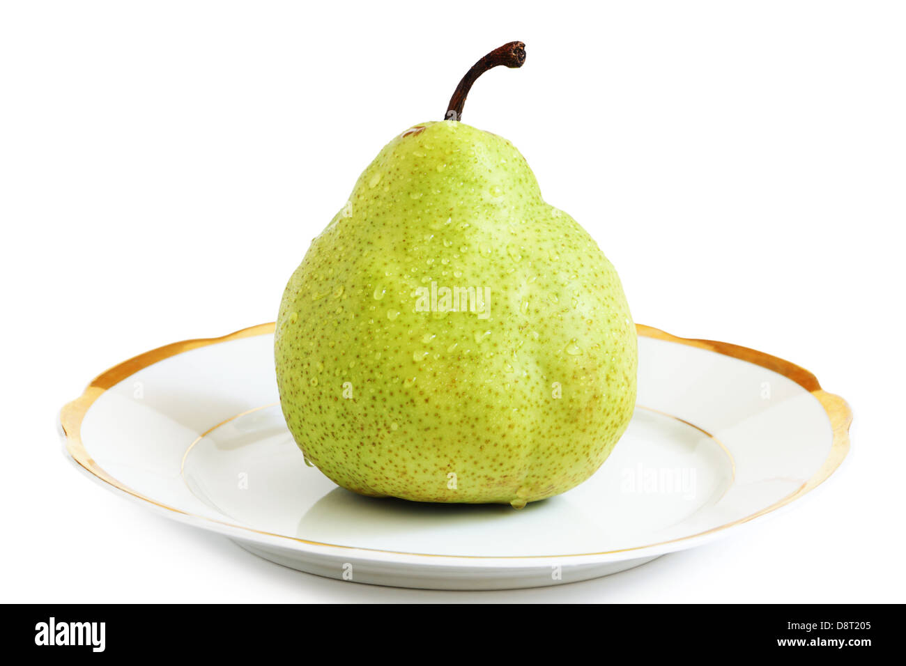 Big green pear with drops on a plate isolated on white background Stock ...