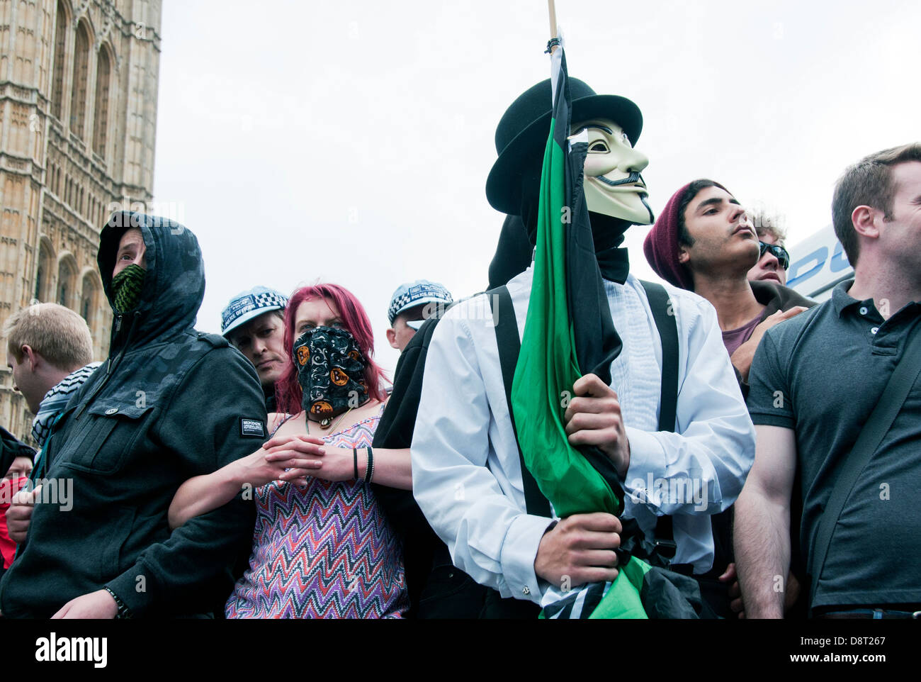 Group of young UAF ( Unite Against Fascism ) protesters linking arms to ...