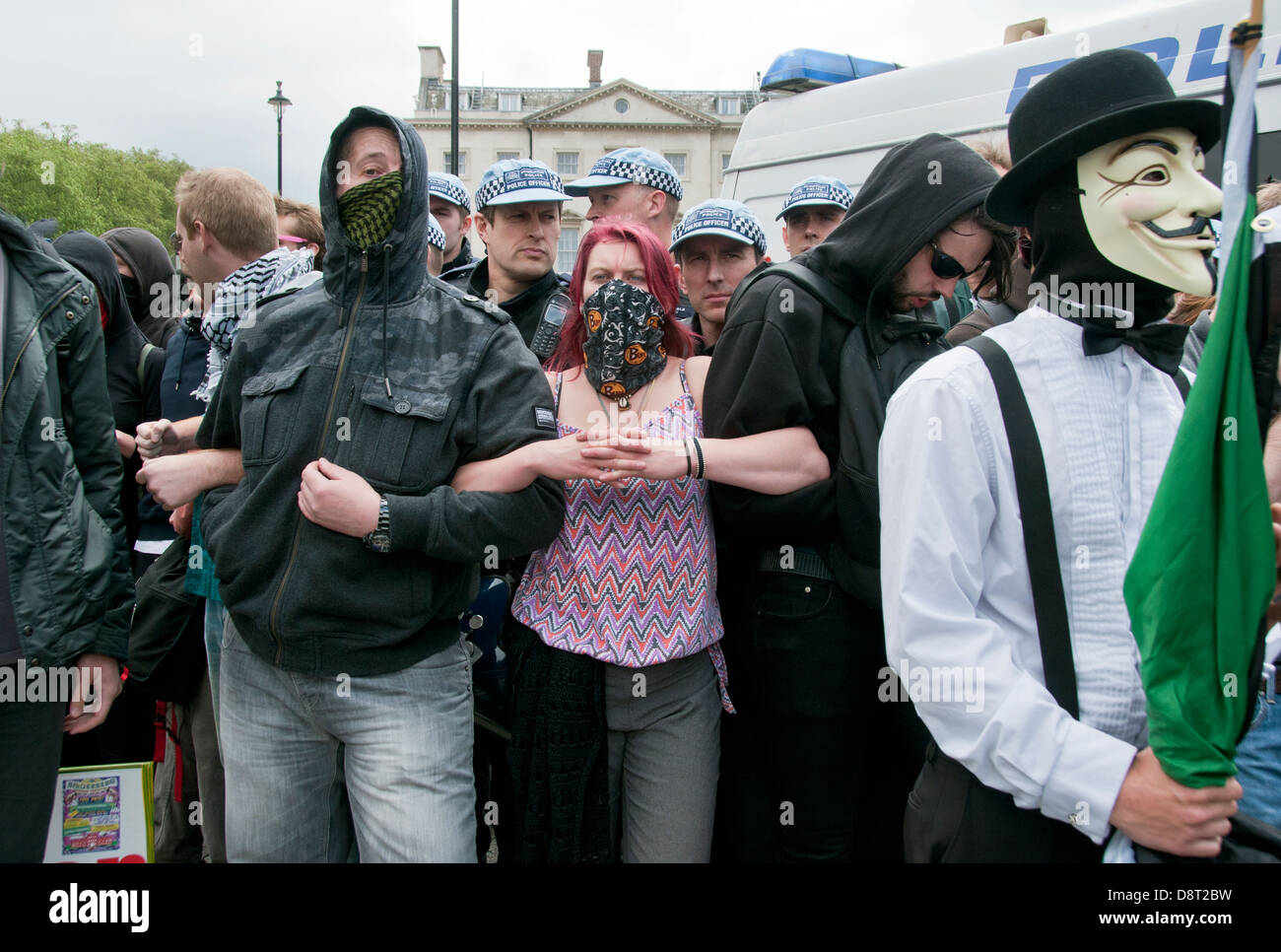 Group of young UAF ( Unite Against Fascism ) protesters linking arms to ...