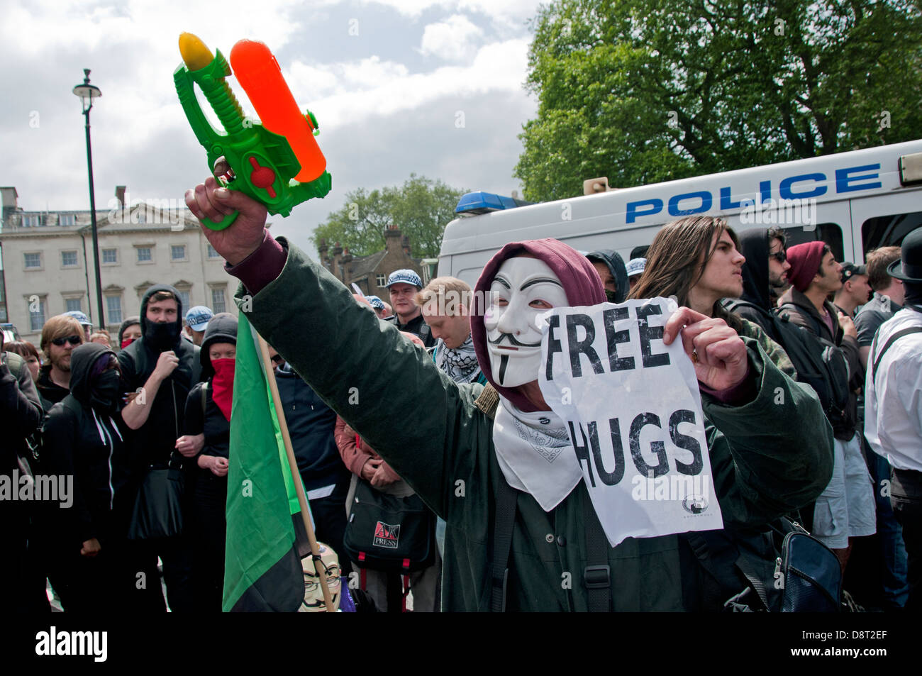 Group of young UAF ( Unite Against Fascism ) protesters linking arms to ...