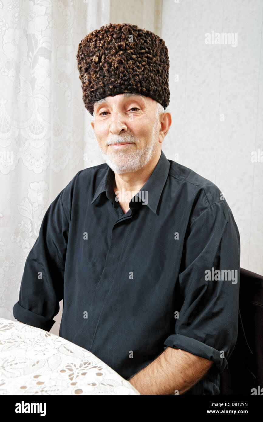 Old man sitting at table hi-res stock photography and images - Alamy