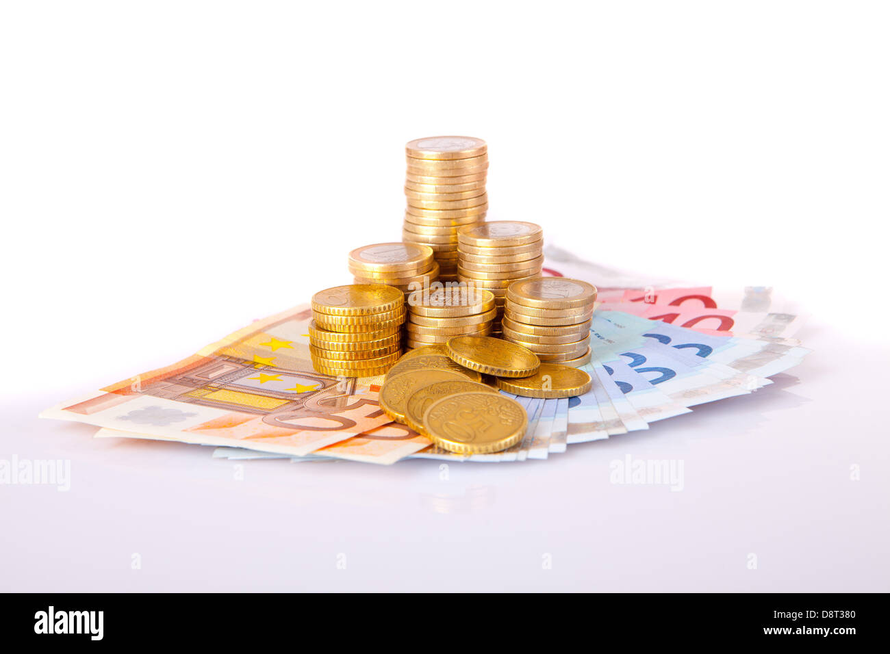 Pile of notes and coins Stock Photo - Alamy