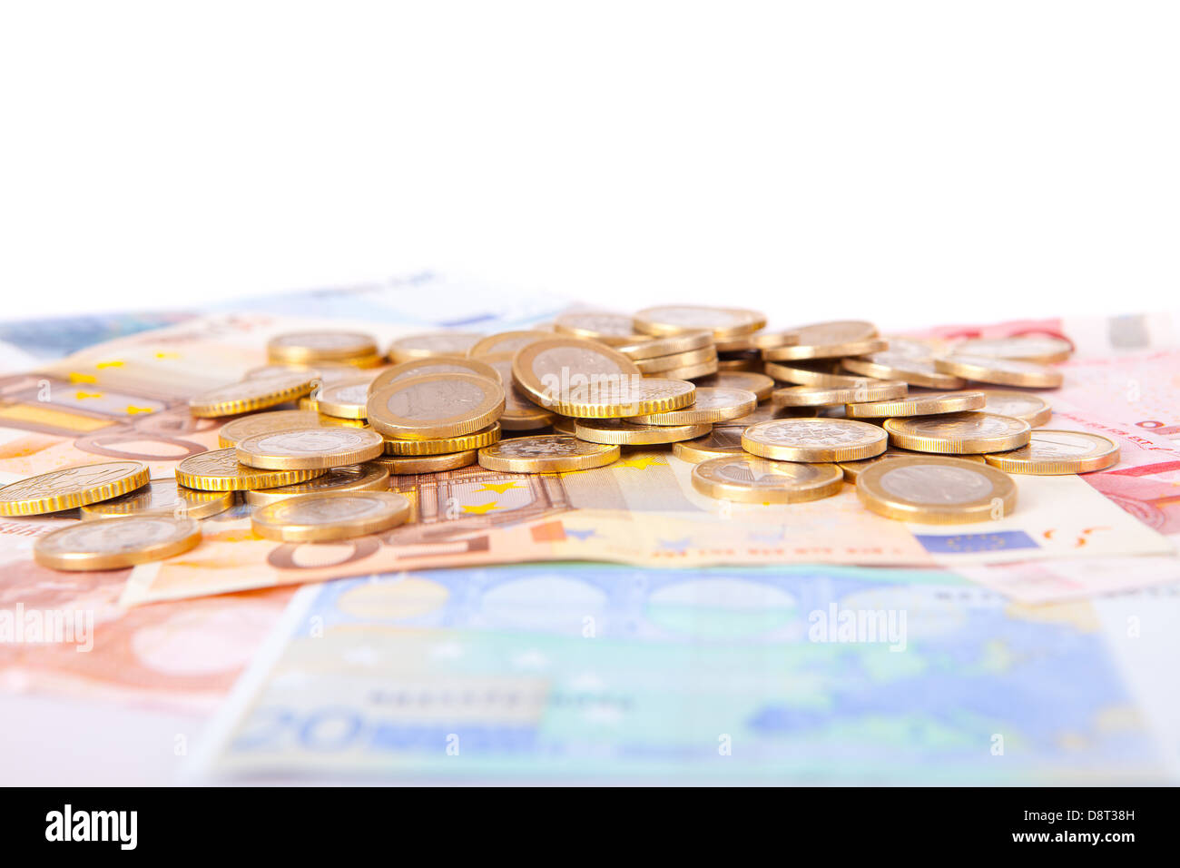 Pile of notes and coins Stock Photo - Alamy