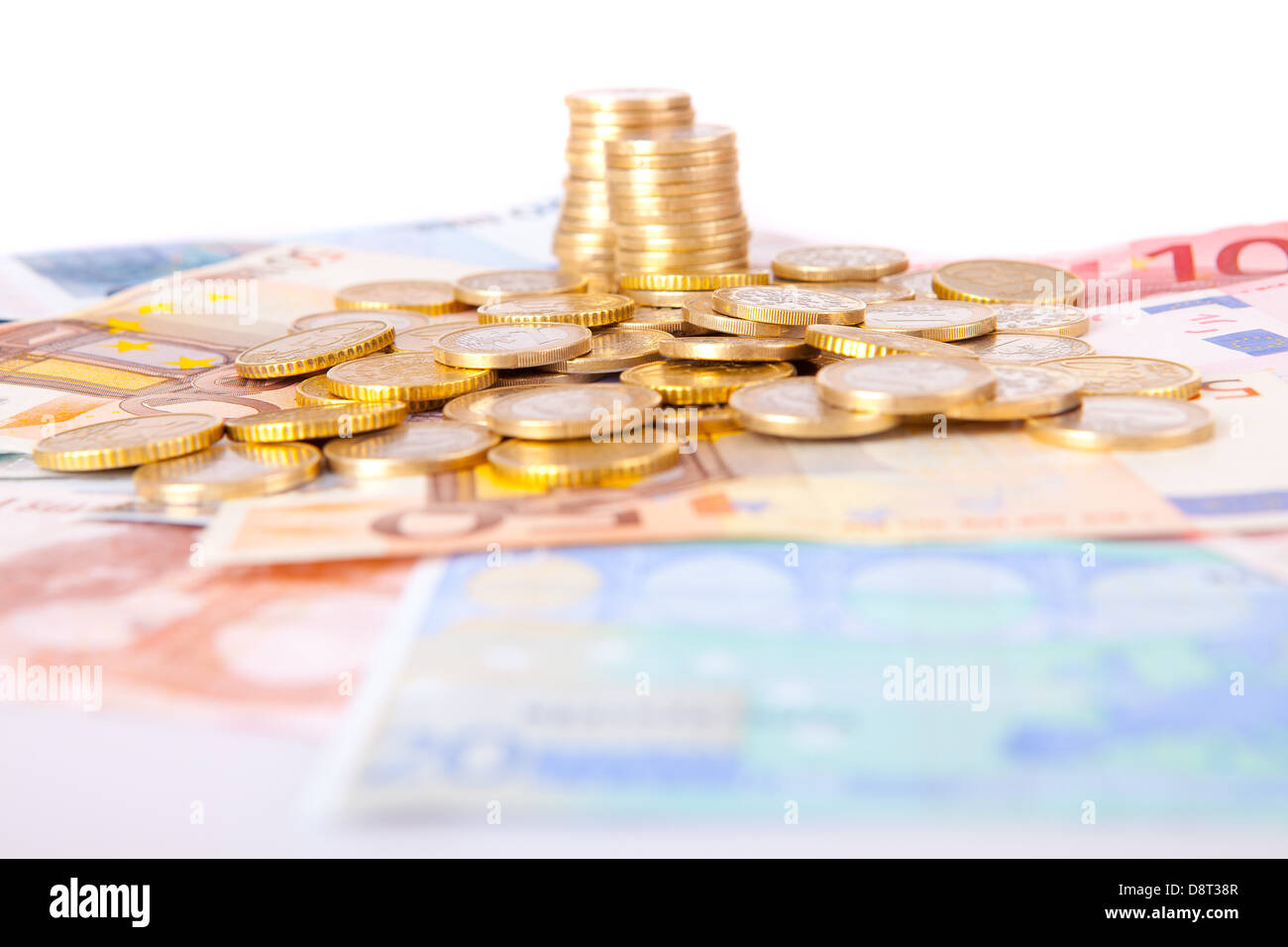 Pile of notes and coins Stock Photo - Alamy