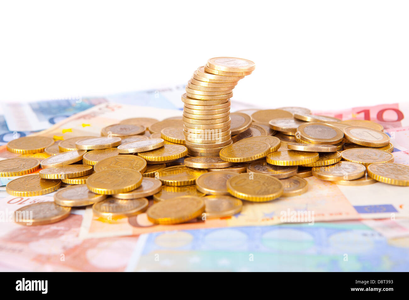 Pile of notes and coins Stock Photo - Alamy